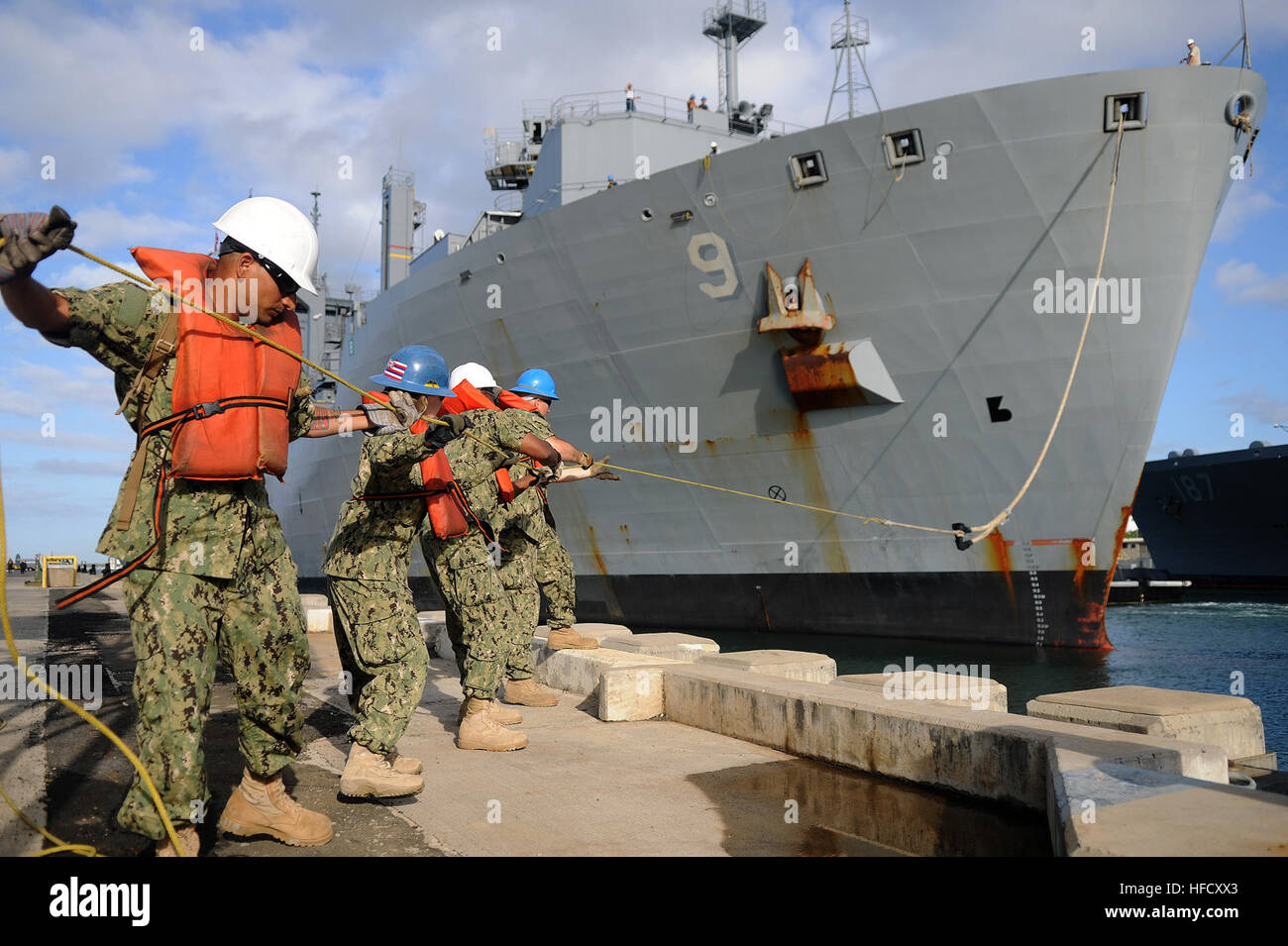 U.S. Sailors assigned to Cargo Handling Battalion 4, Air Cargo handle a ...