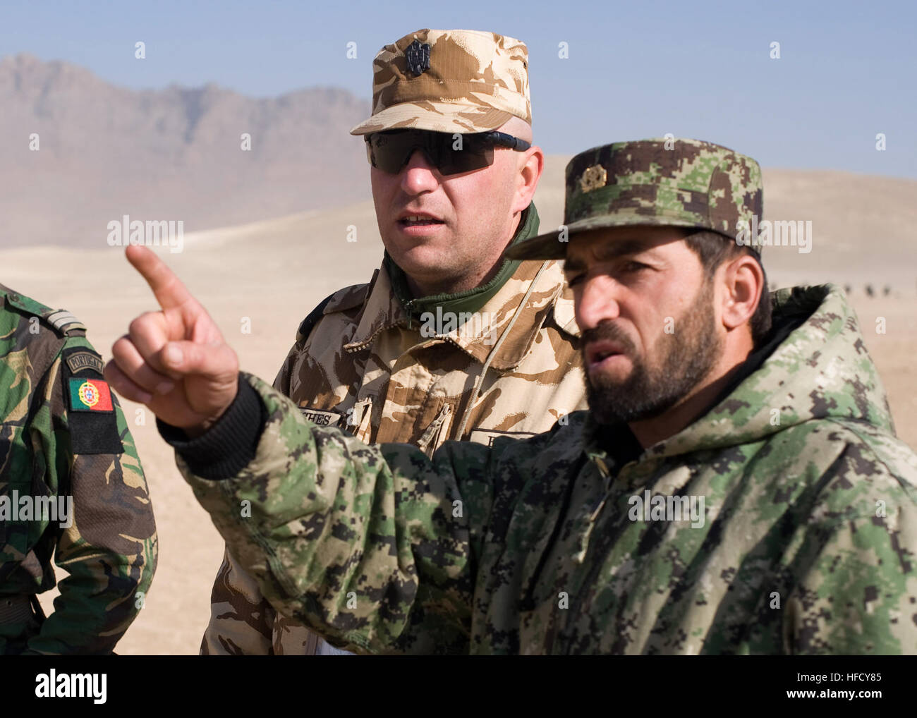 An Afghan National Army Basic Warrior Training instructor talks to ...