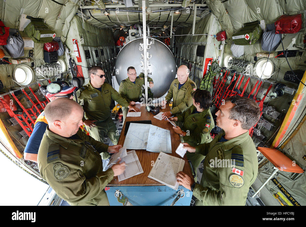 The crew of a Canadian C-130 Hercules, assigned to 435 Transport and ...