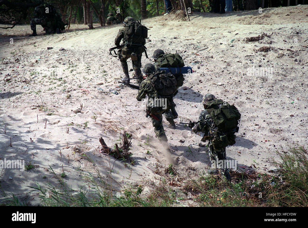 Philippine Marines charge up the beach at Marine Base Ternate, while ...