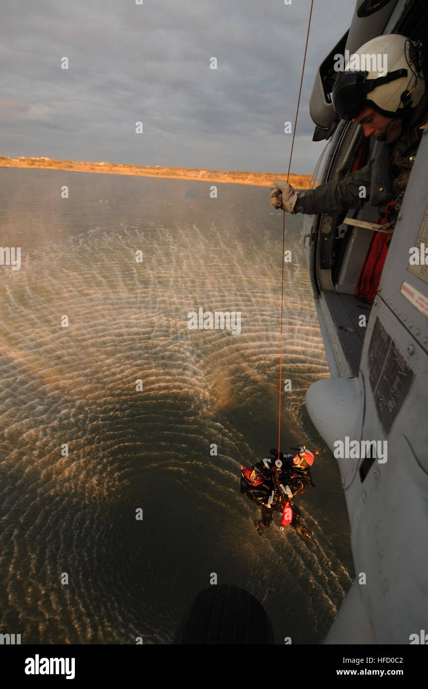 NORFOLK (Feb. 28, 2013) A naval aircrewman hoists Naval Aircrewman ...