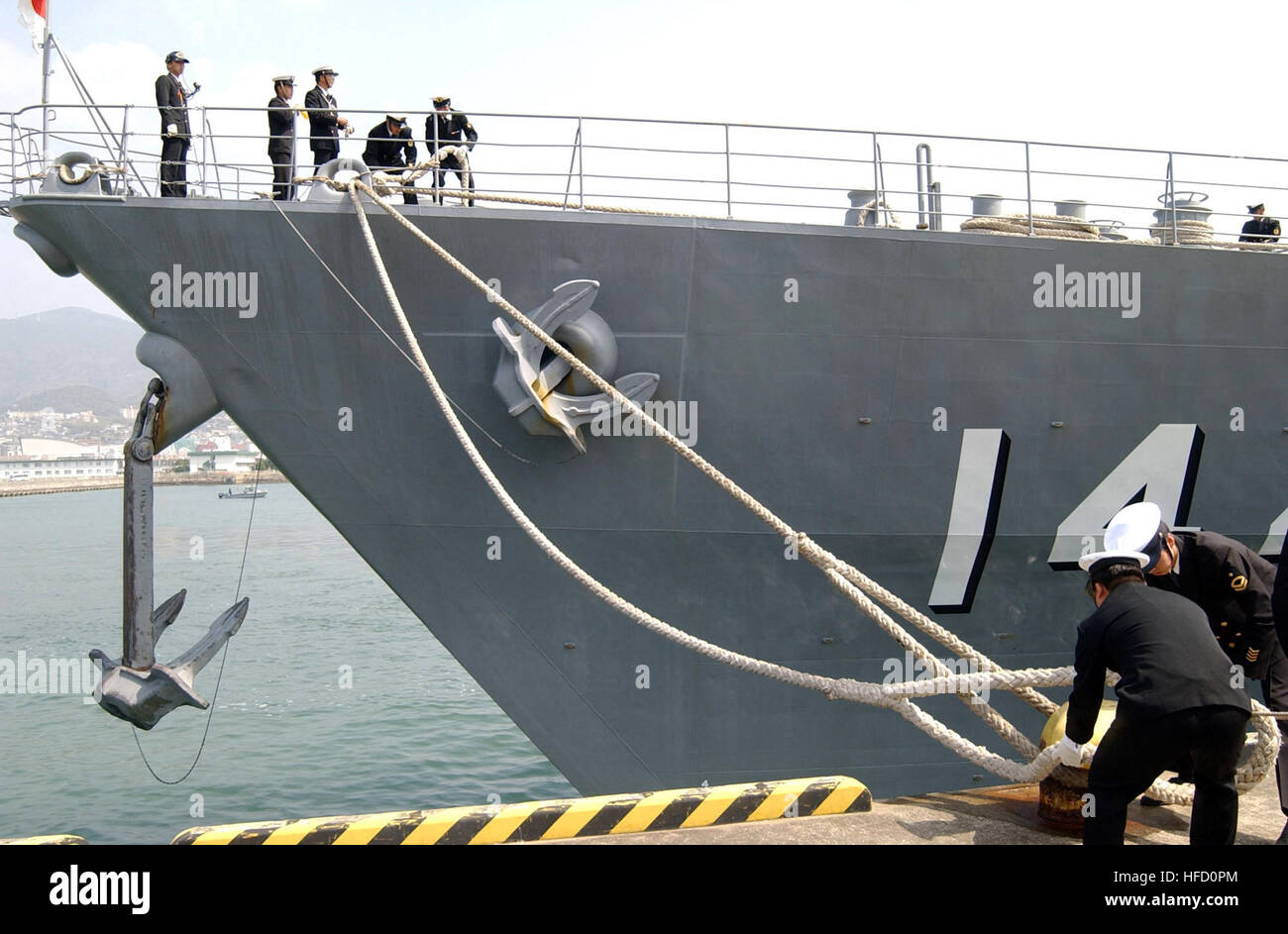Sailors from the Japan Maritime Self-Defense Force moor the ship JDS ...