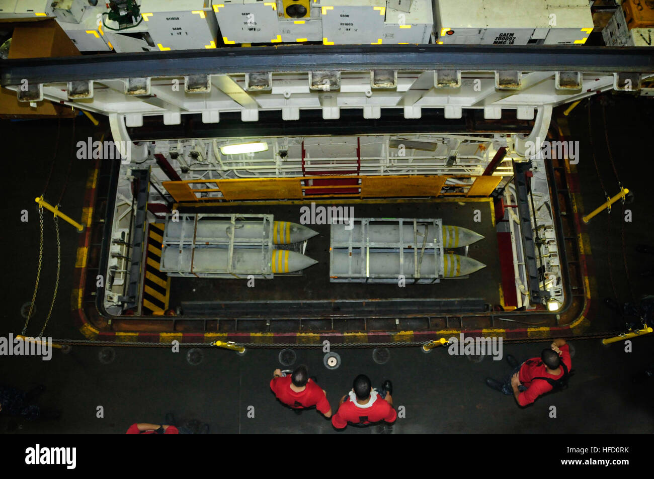 Sailors from the USS Nimitz Weapons Department raise ordnance on the ...