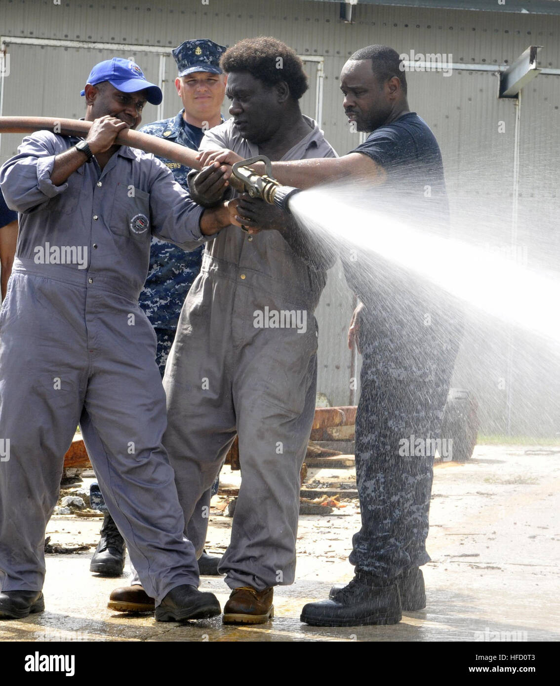 Petty Officer 1st Class Charles Patterson, damage controlman, shows ...