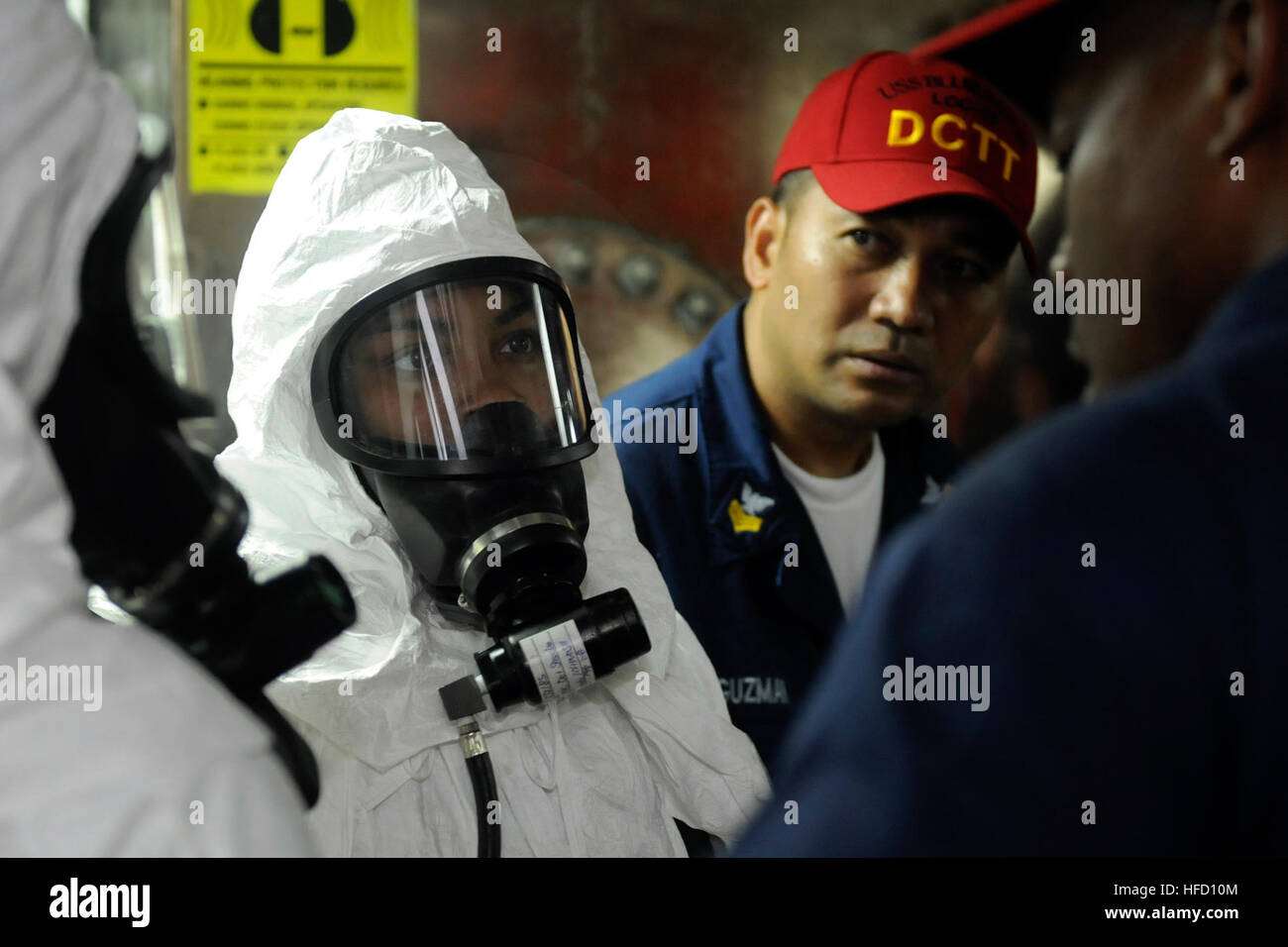 Damage control training team members train Petty Officer 3rd Class ...