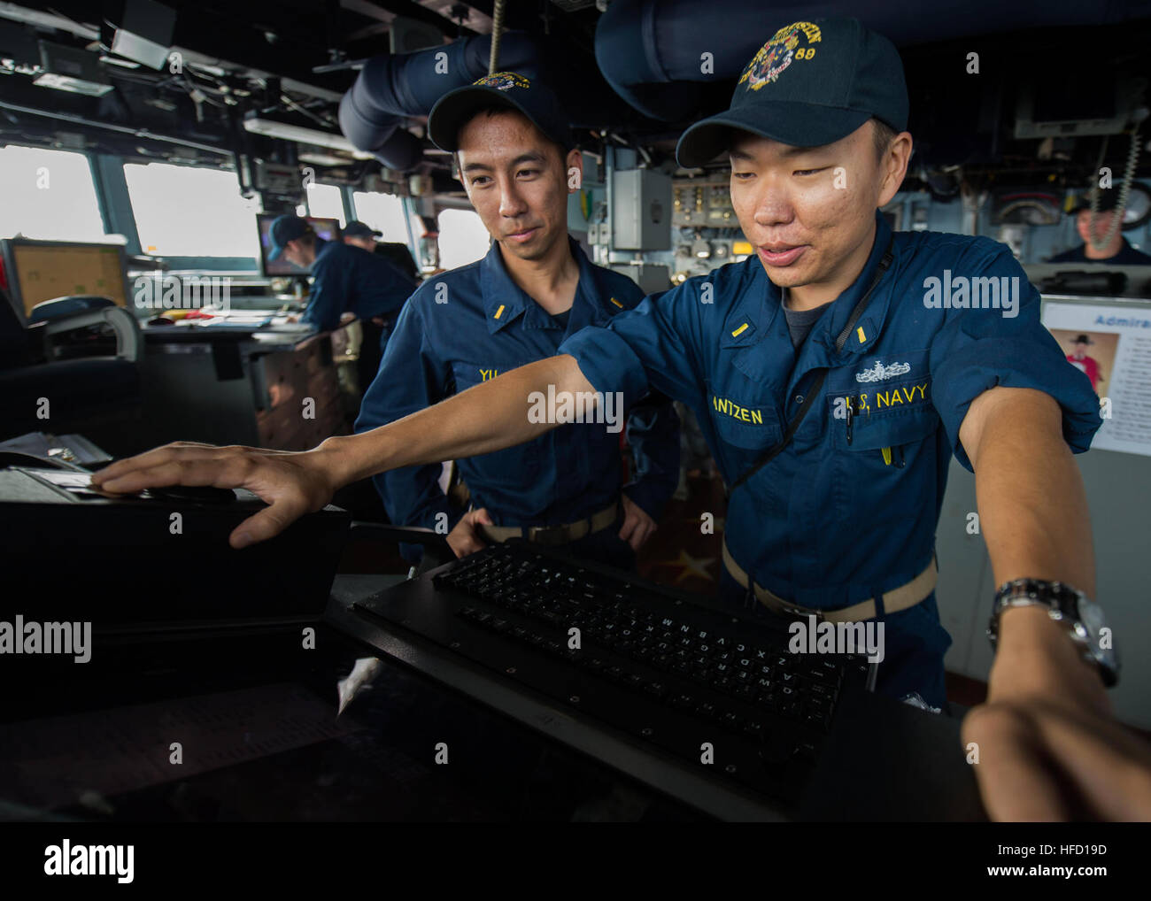 SOUTH CHINA SEA (Nov. 4, 2013) Ensign Anand Jantzen, right, and Ens ...