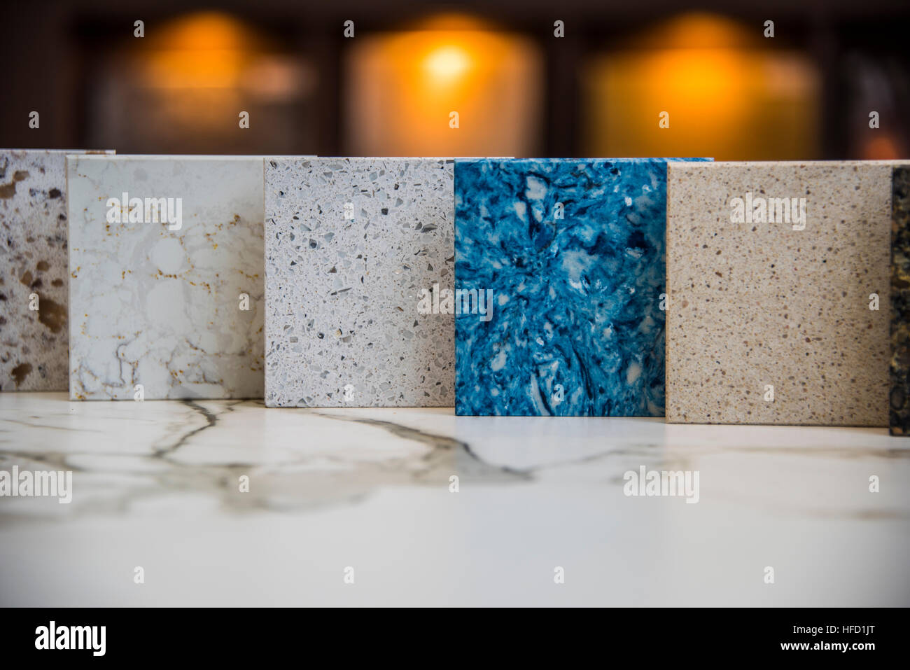 Colorful kitchen worktops lined on white marble worktop Background ...