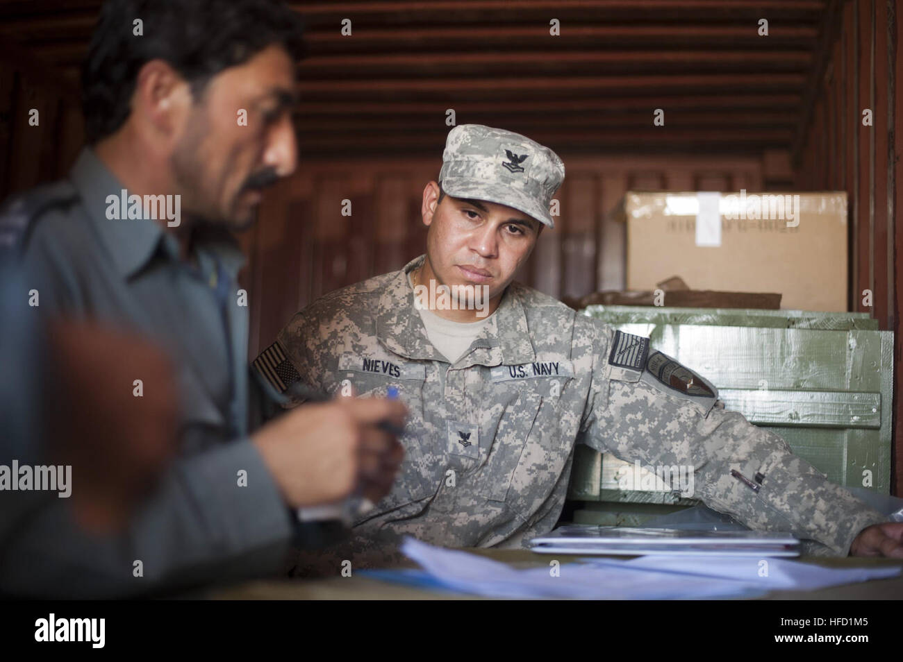 Petty Officer 2nd Class Ramon Nieves, right, from Naval Air Station ...
