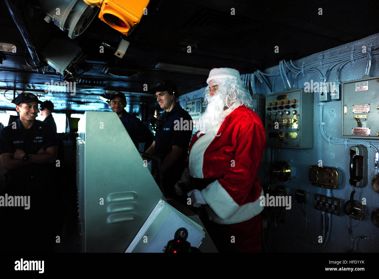 Santa Claus takes the helm on the bridge of the aircraft carrier USS ...