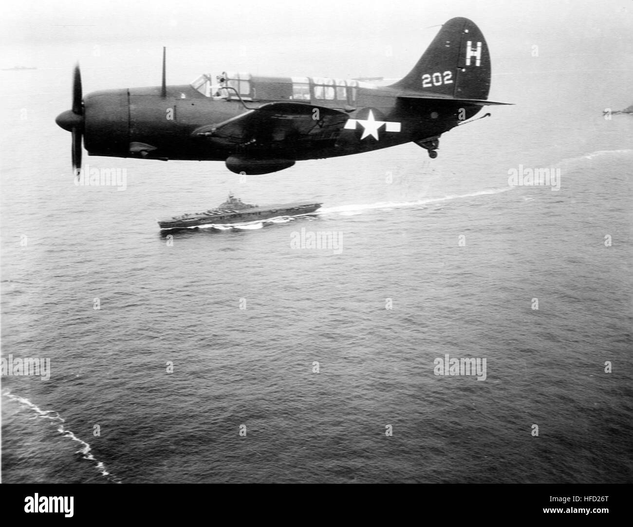 SB2C-4E of VB-94 over USS Lexington (CV-16) 1945 Stock Photo - Alamy