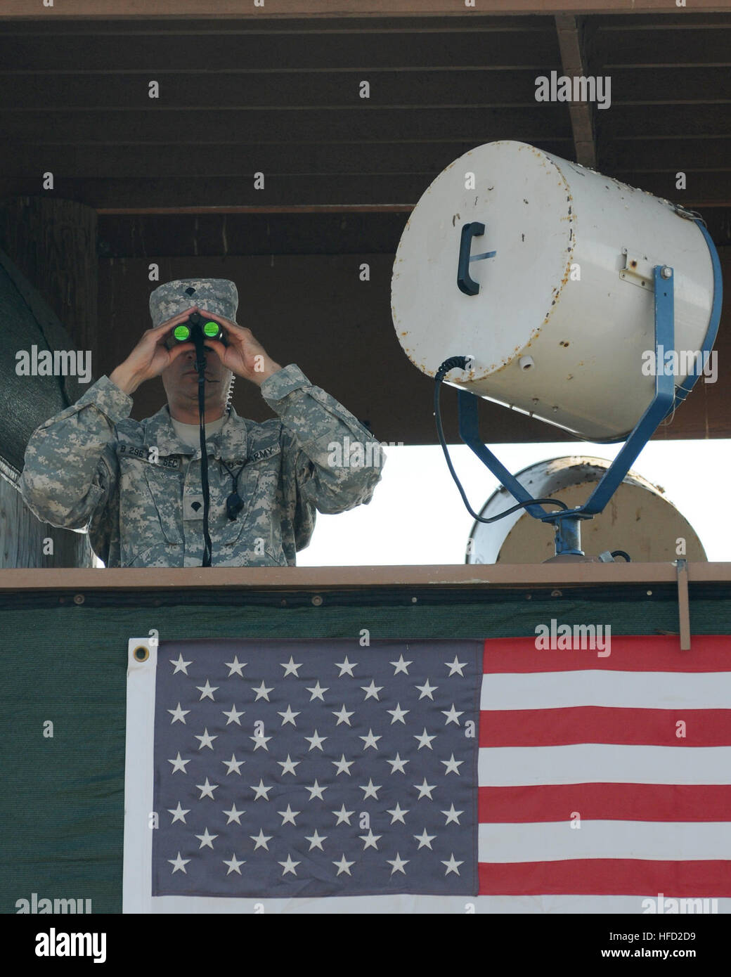 Spc. Quinones Alberto scans the perimeter of Camp Delta while on guard ...