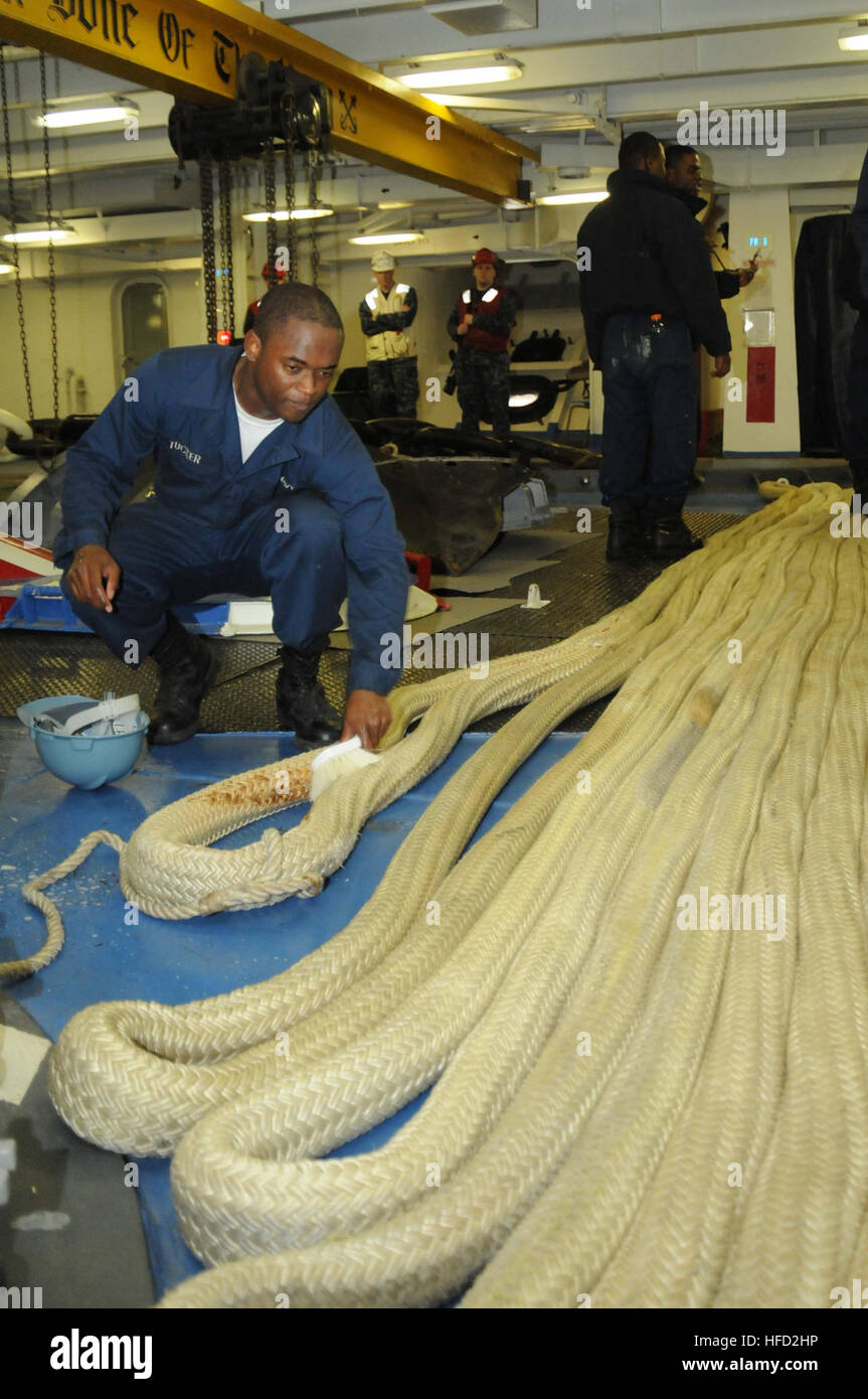 Seaman Terry Tucker scrubs lines with soap and water after a mooring ...