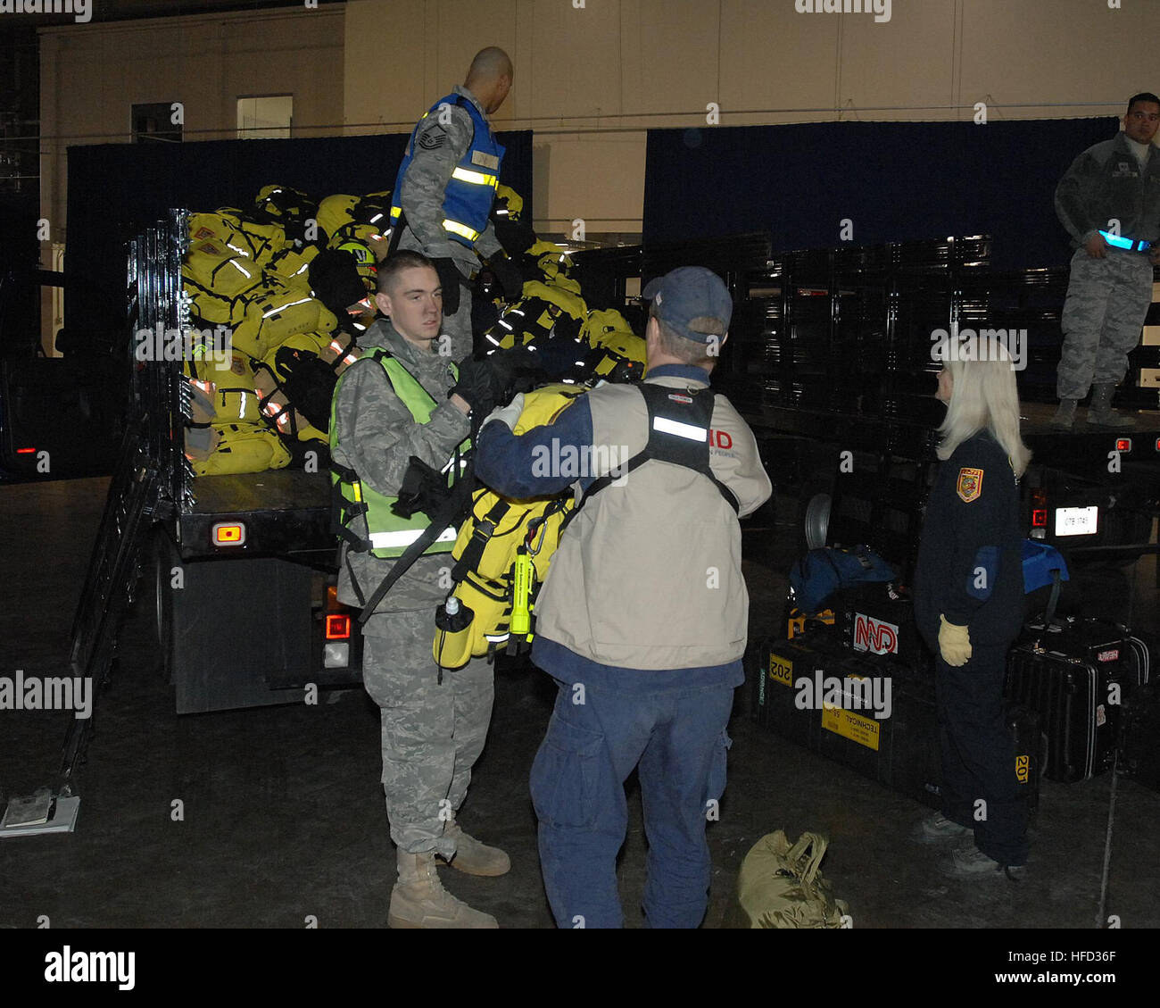Airman 1st Class Ryan Lloyd, left, offloads gear with the help of ...