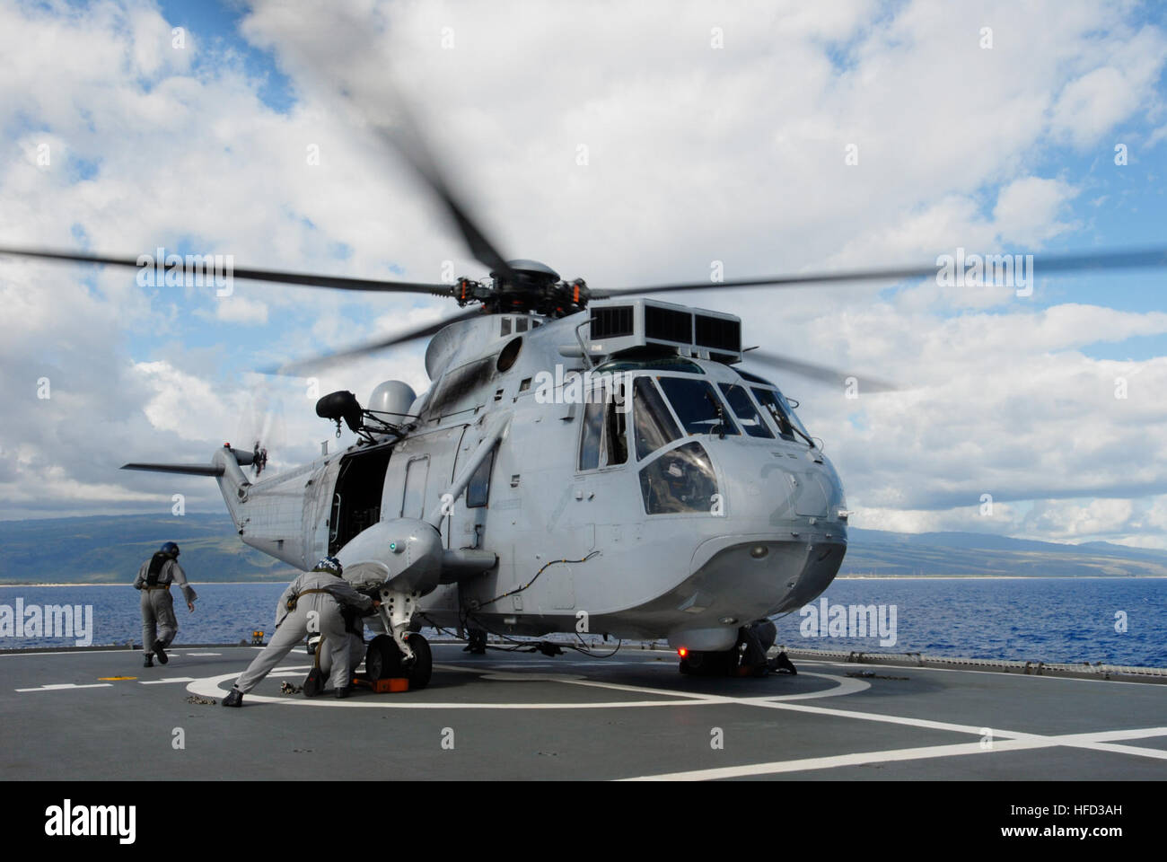 HMAS Tobruk- Royal Australian Navy (RAN) sailors tie a RAN SH-3 Sea ...