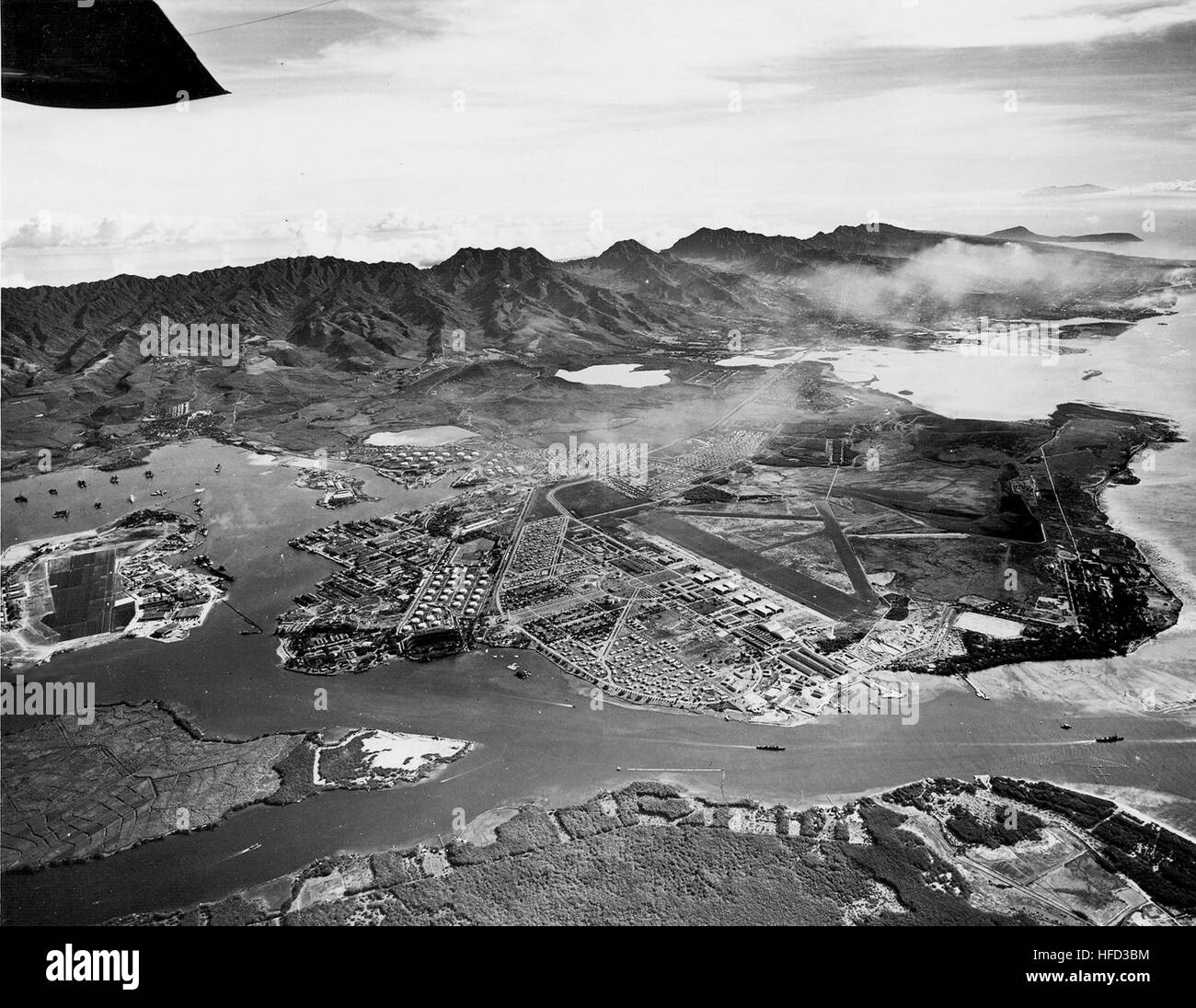 An aerial view shows Pearl Harbor and Hickam Air Force Base, including ...