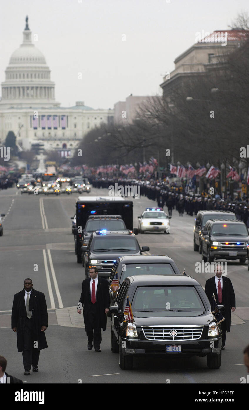 Flanked by Secret Service agents, US President George W. Bush and First ...