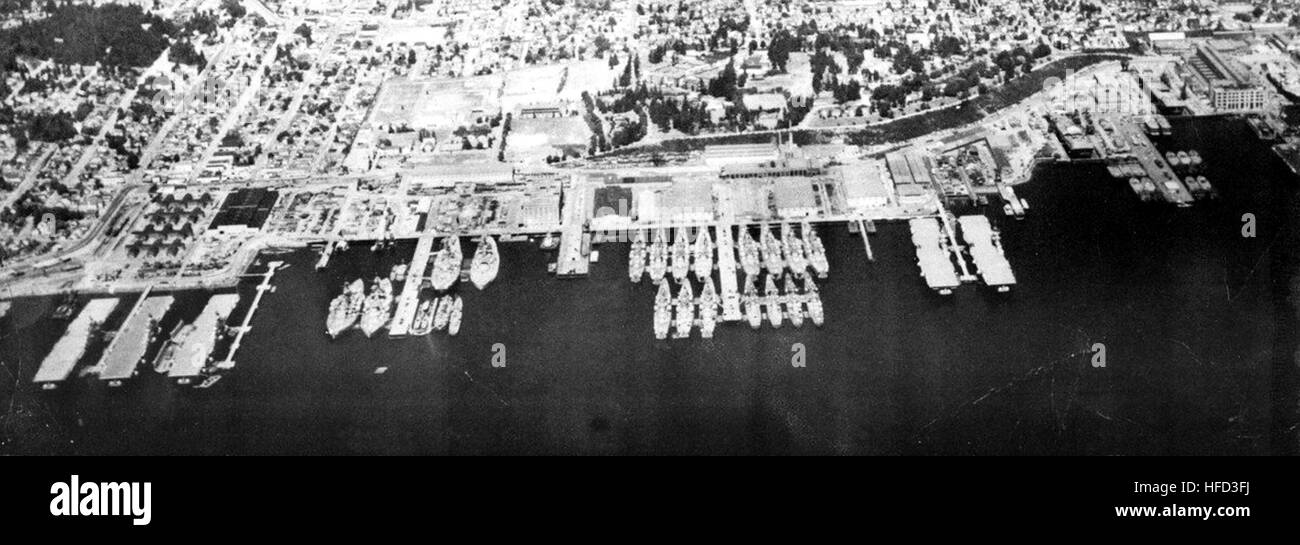 An aerial photograph shows Puget Sound Naval Shipyard with multiple ...