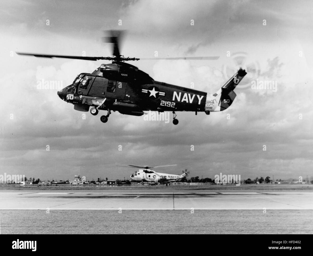 An SH-2F Seasprite helicopter from HSL-31 and an SH-3H Sea King from HS ...