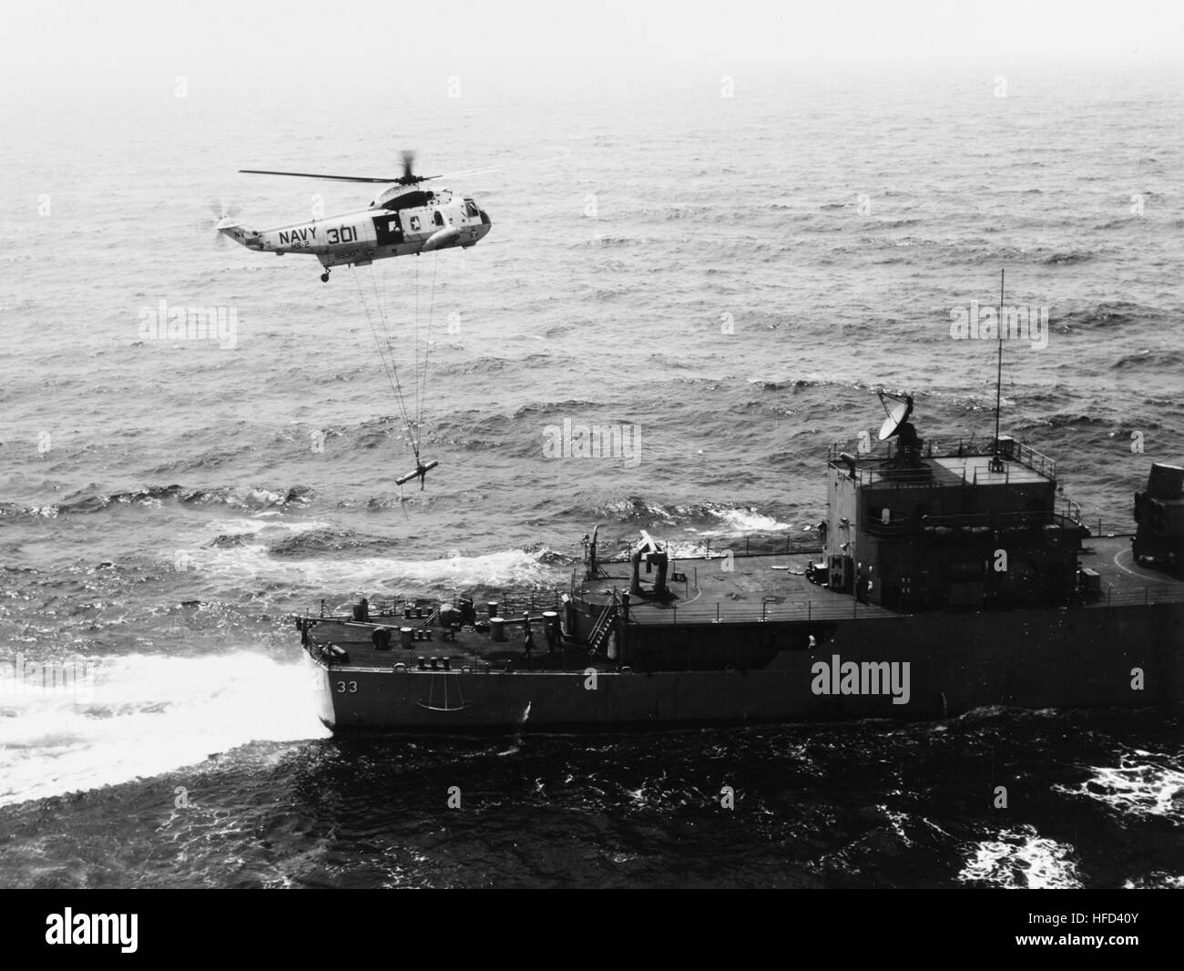 SH-3A of HS-2 lowers torpedo on USS Parsons (DDG-33) in April 1969 ...