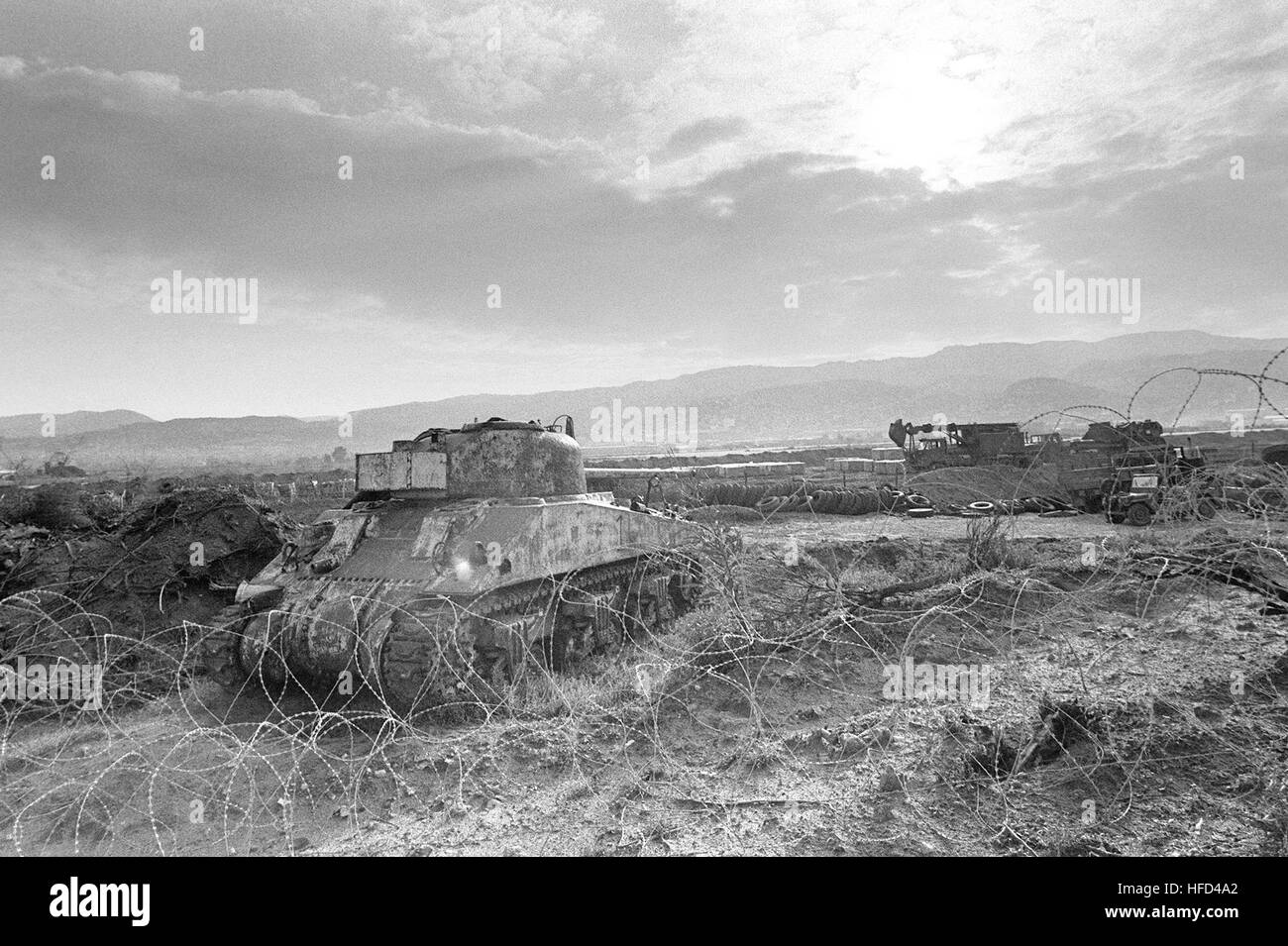 A left front view of a wrecked and stripped Israeli M50 Mark II Sherman ...