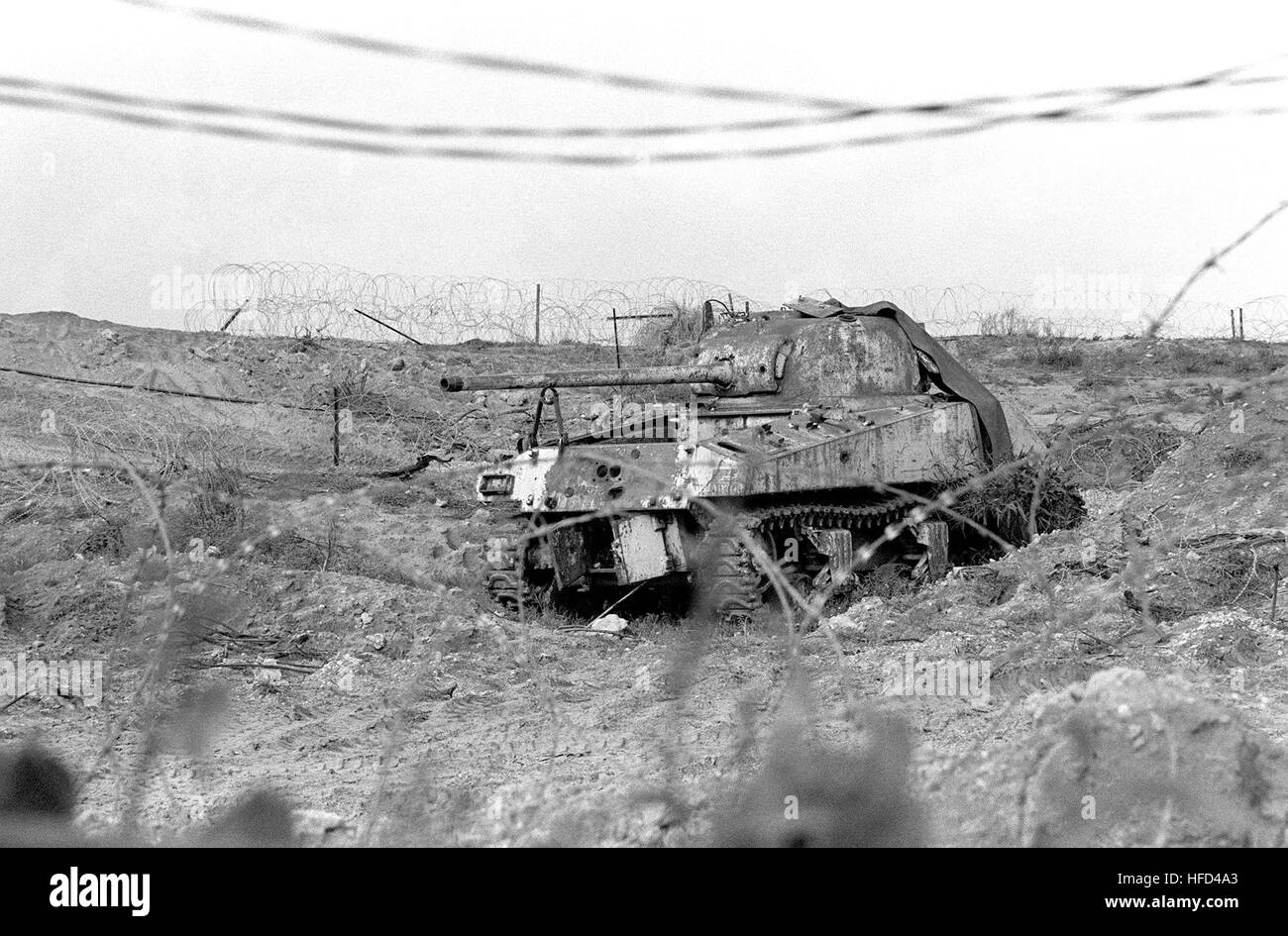 A right rear view of a wrecked and stripped Israeli M50 Mark II Sherman ...