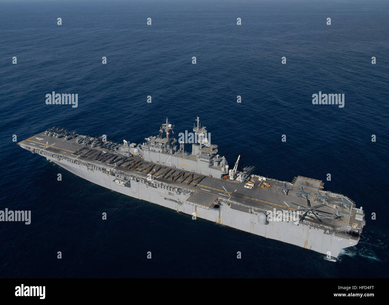Sailors aboard the amphibious assault ship USS Boxer (LHD 4) and ...