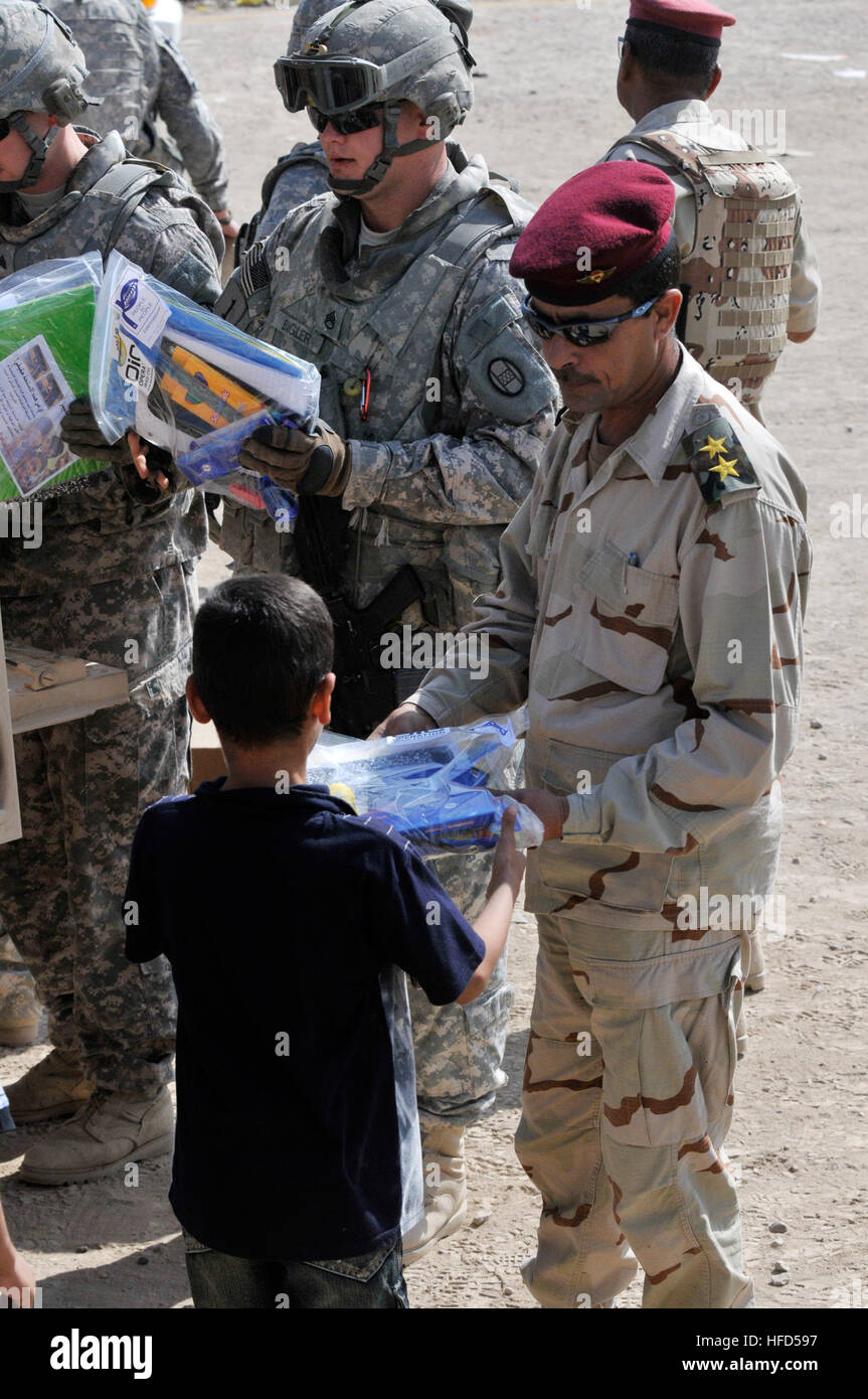 U.S. and Iraqi soldiers conduct humanitarian school supply drops near ...