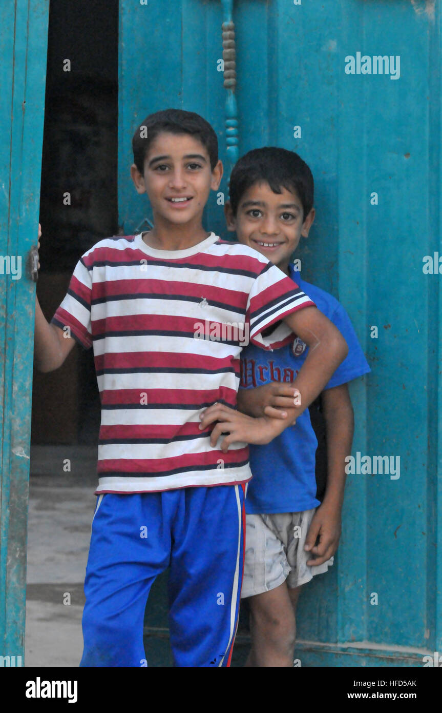 Two young boys pose for the camera in Ghazaliyah, Iraq, July 15 ...