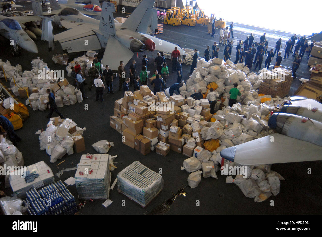 Sailors aboard aircraft carrier USS Dwight D. Eisenhower sort 32,000 ...