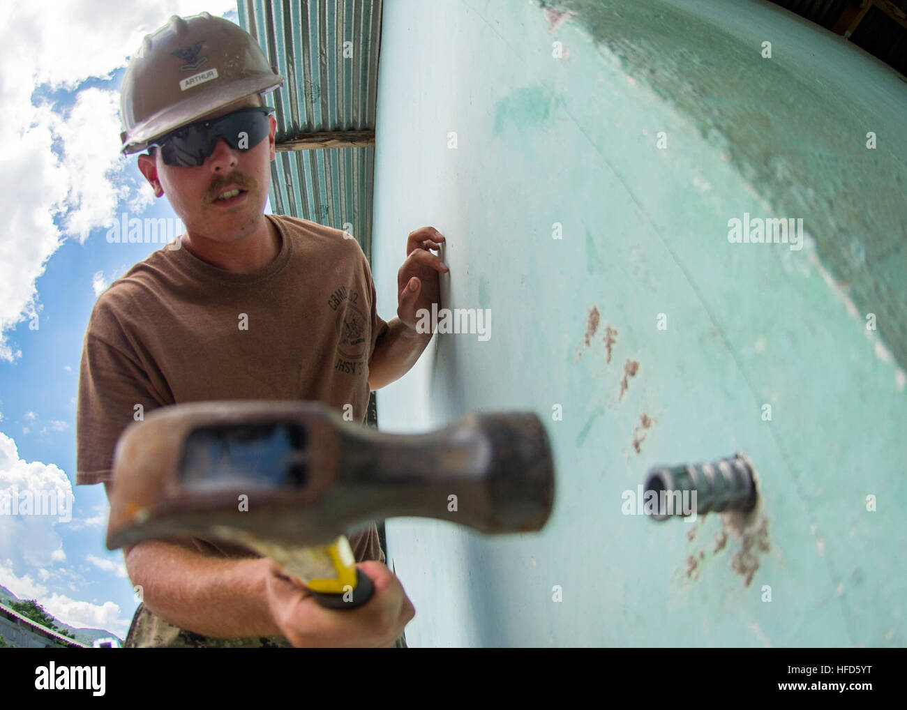 U.S. Navy Utilitiesman 2nd Class Robert Arthur, assigned to ...