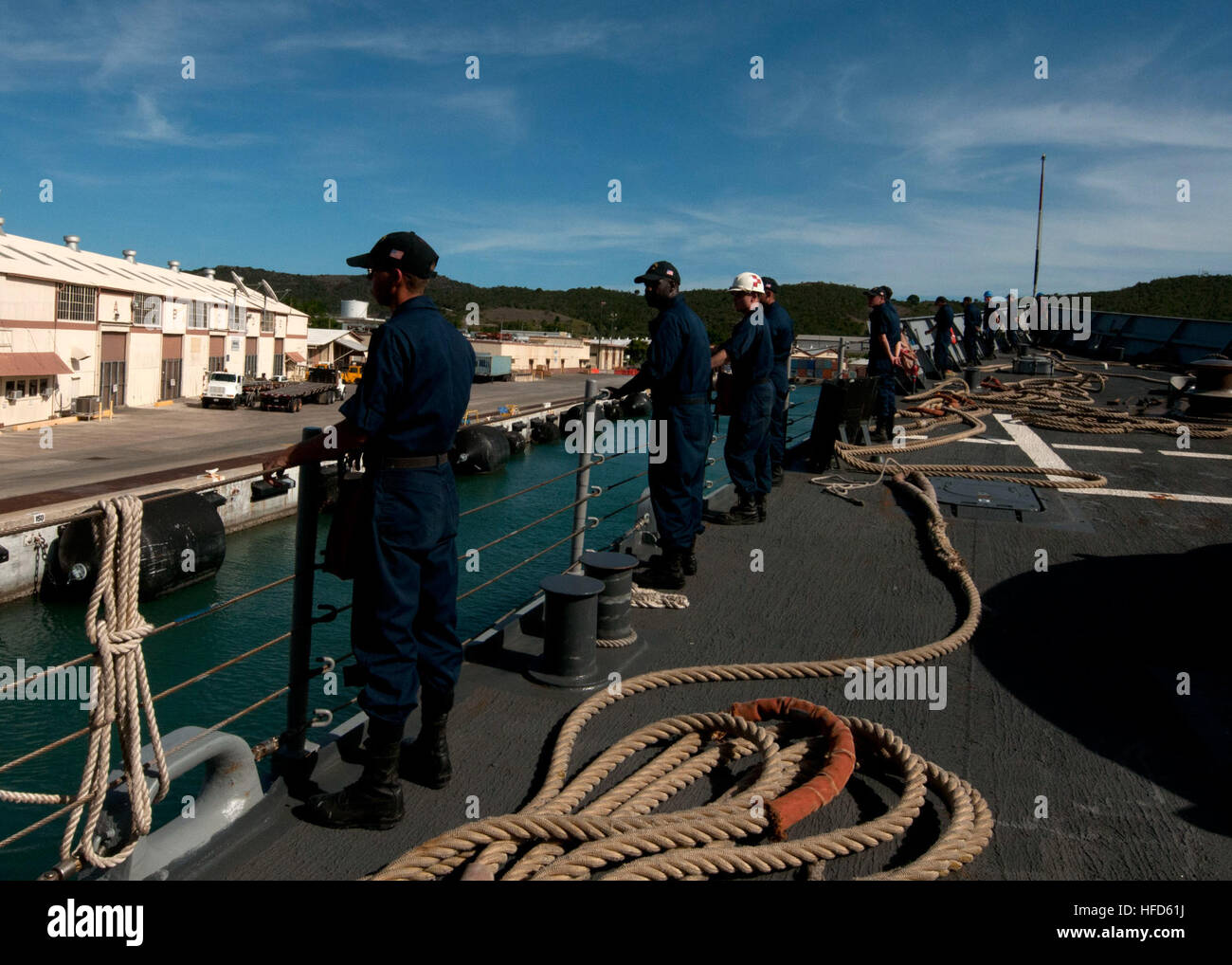 U.S. sailors man the rails on the forecastle as guided missile frigate ...