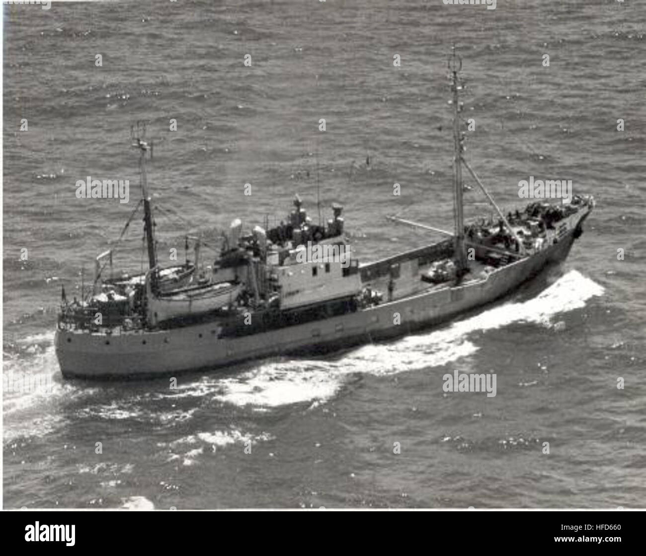 A Soviet trawler is observed from USS Pocono during naval operations ...