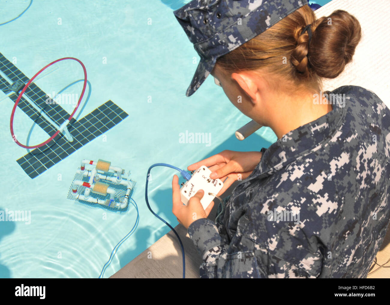 A Naval Sea Cadet pilots her SeaPerch Remotely Operated Vehicle (ROV ...