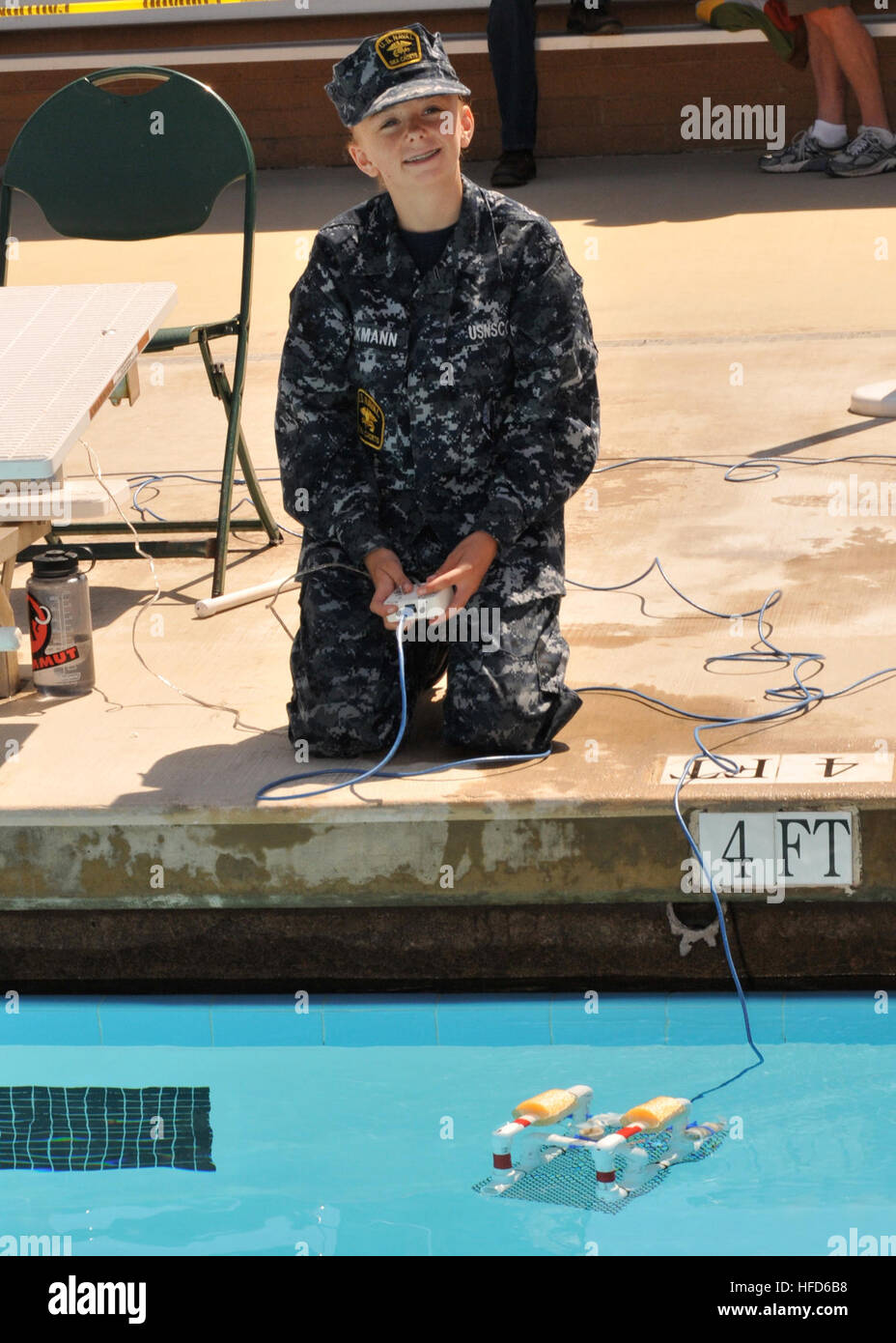 A U.S. Navy Sea Cadet waits for the signal to run her SeaPerch Remotely ...