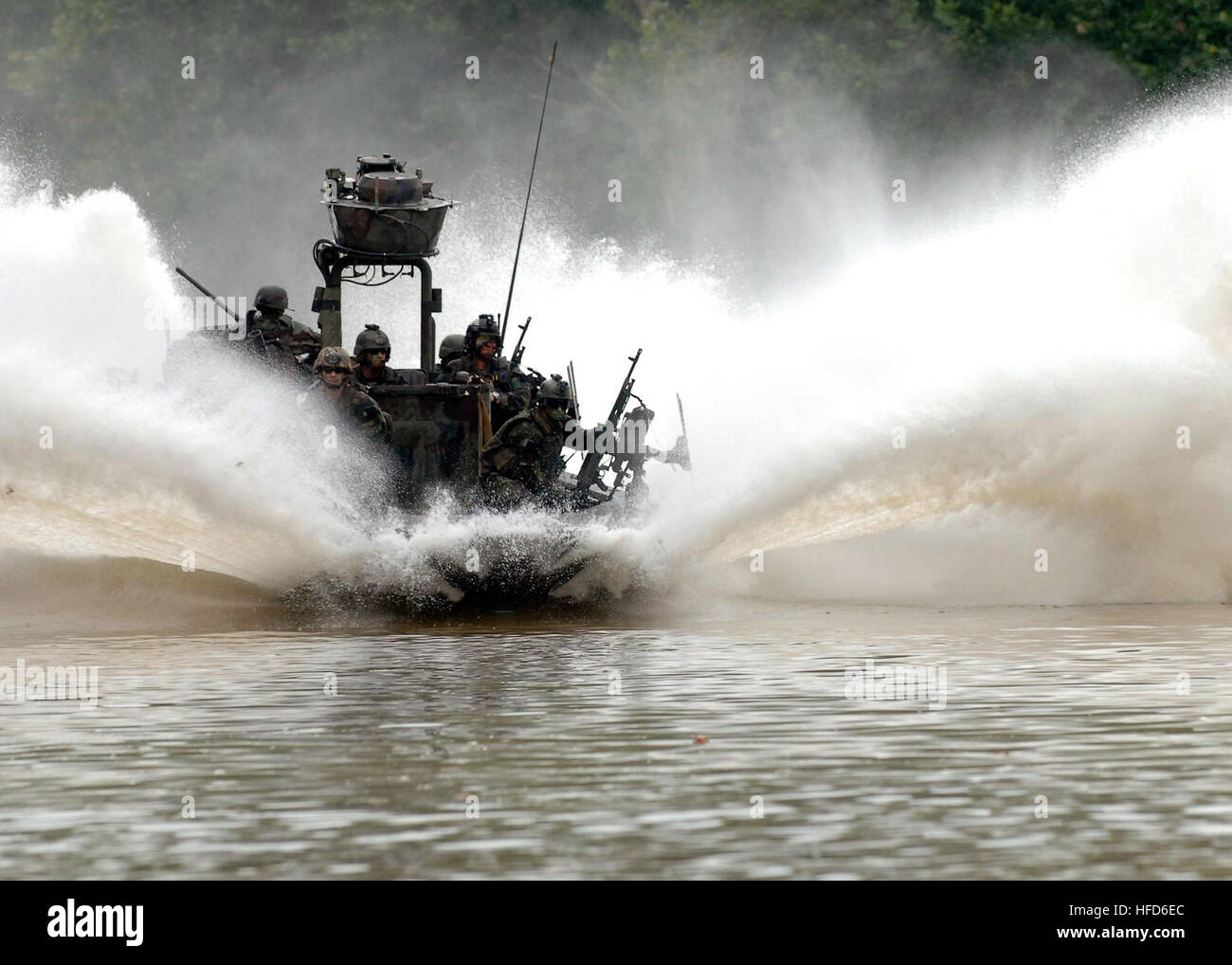 A Special Operations Craft-Riverine (SOC-R) crew performs a crash-back ...