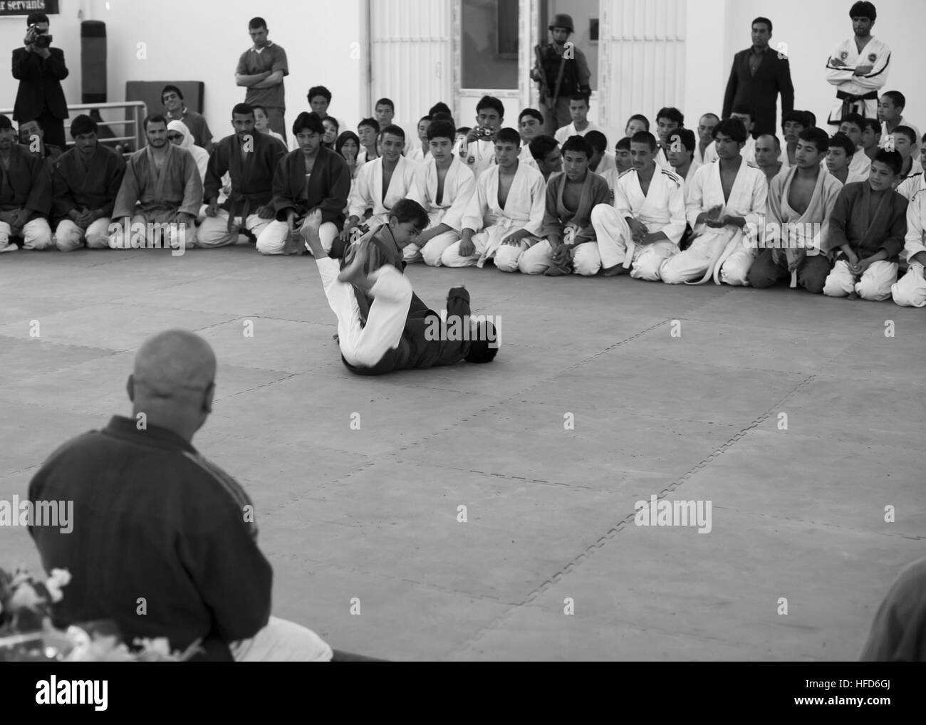 Martial artists demonstrate skills during the opening of a gym for the ...