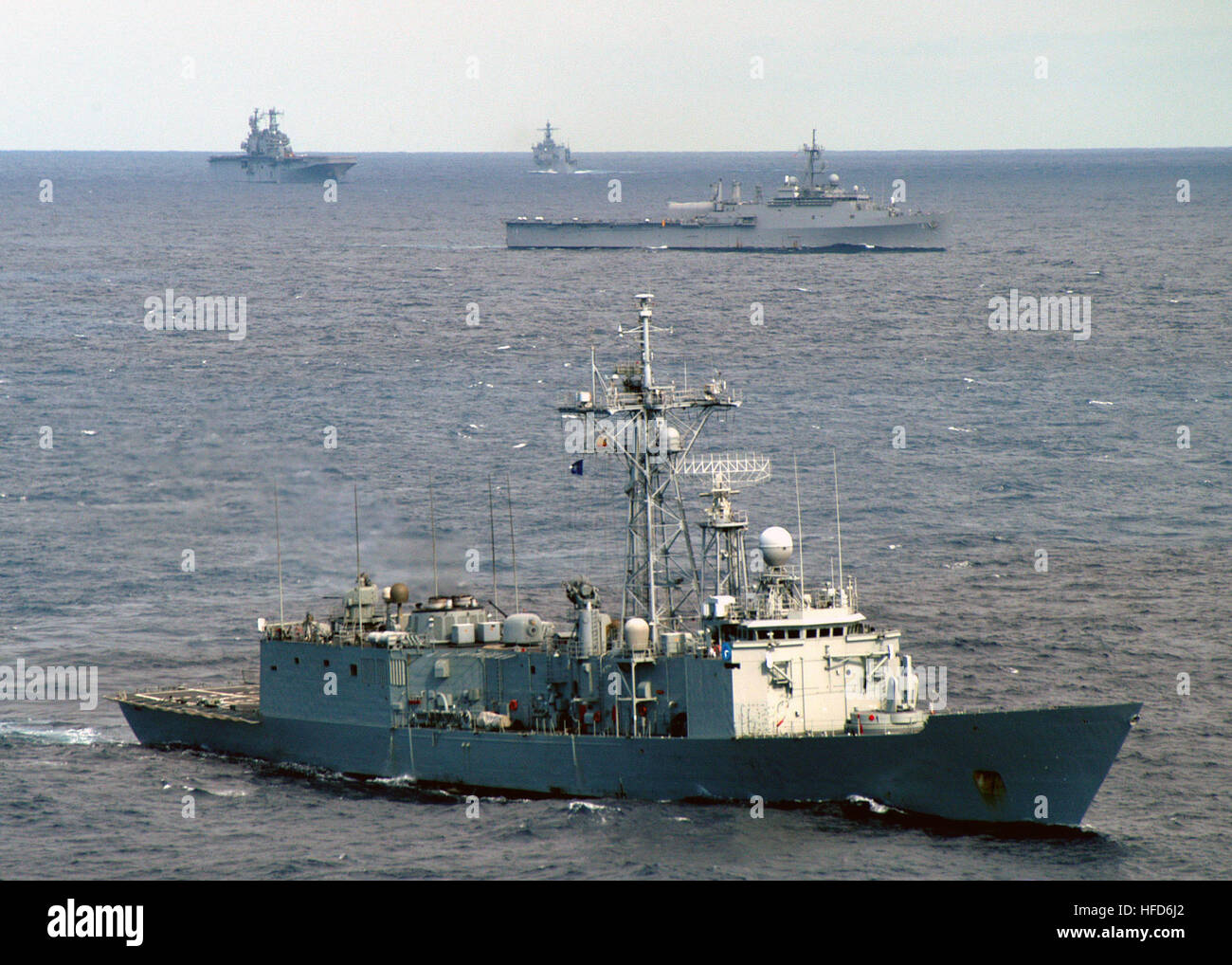 US Navy (USN) and Spanish Navy ship maneuver through the waters of the ...