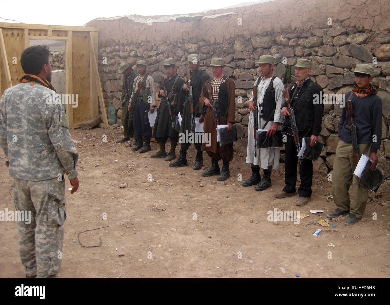 An Afghan Local Police Commander, congratulates 12 new ALP members ...