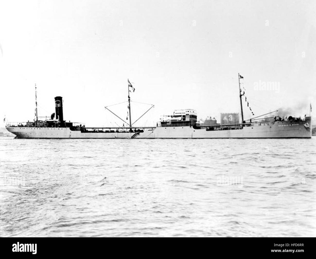 The merchant vessel SS George G. Henry is shown in port or underway ...