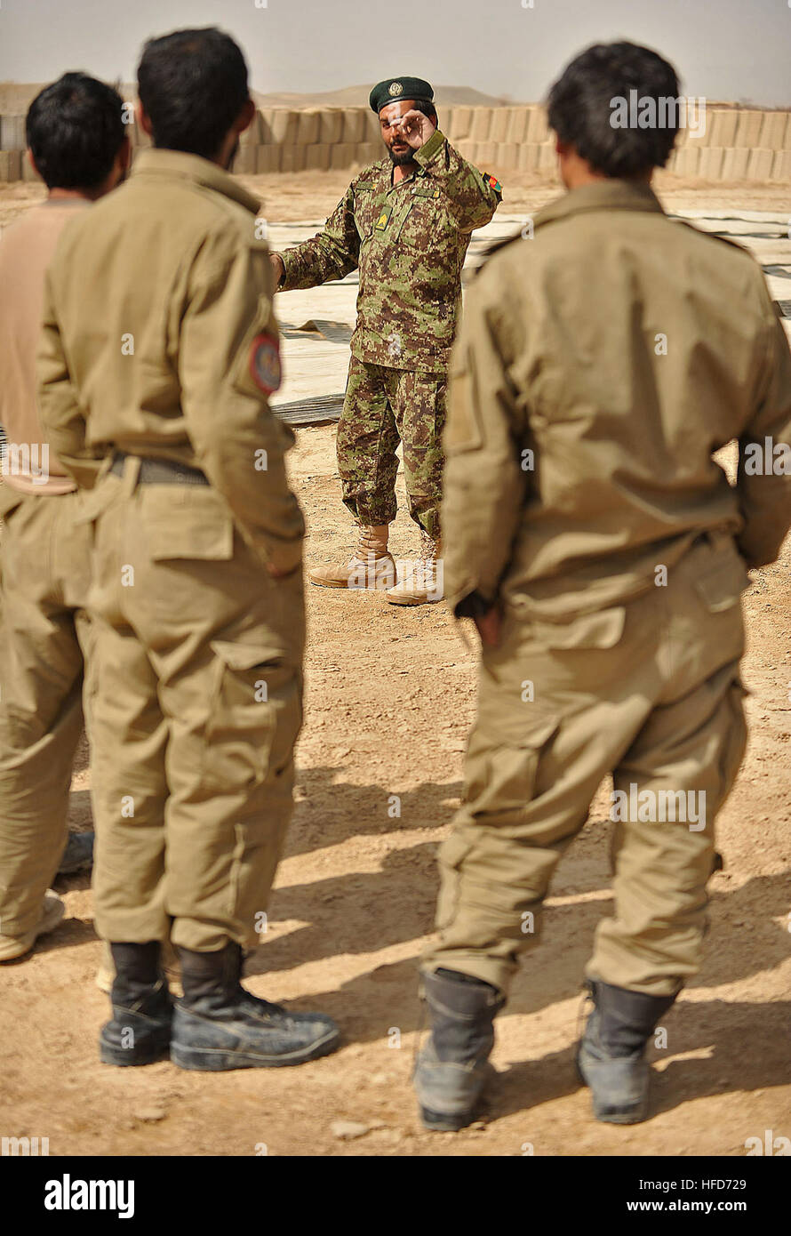 An Afghan National Army soldier talks to Afghan Local Police recruits ...
