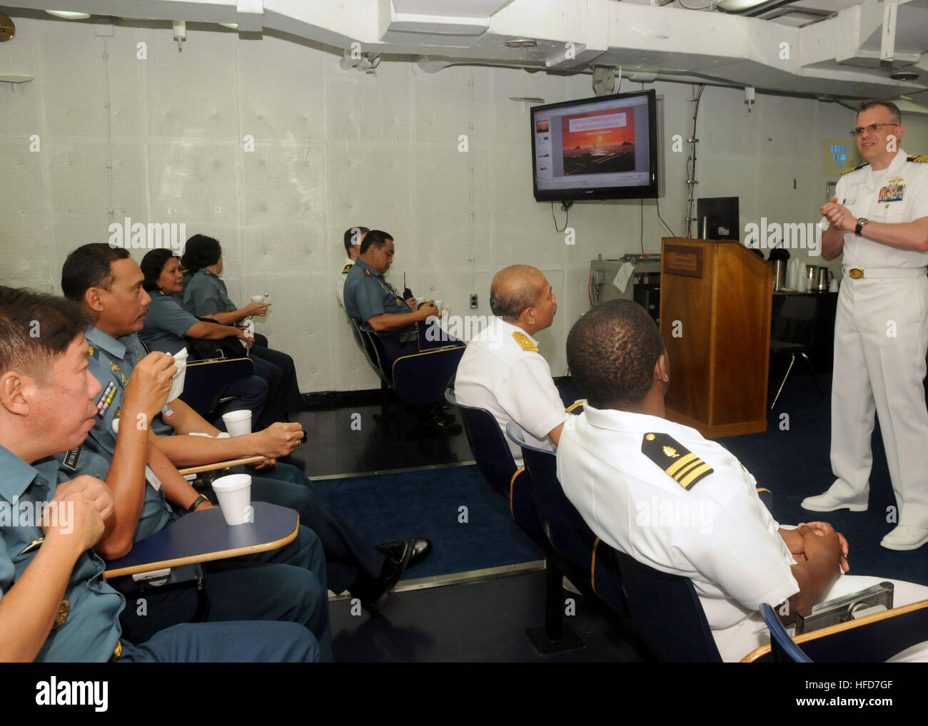U.S. Navy Capt. Eric Staats, right, a knowledge management officer with ...