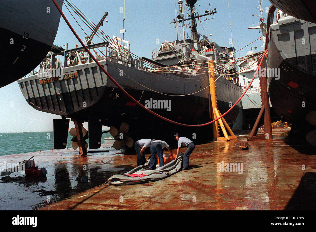 Crew members aboard the Dutch heavy lift ship SUPER SERVANT 3 set up an ...