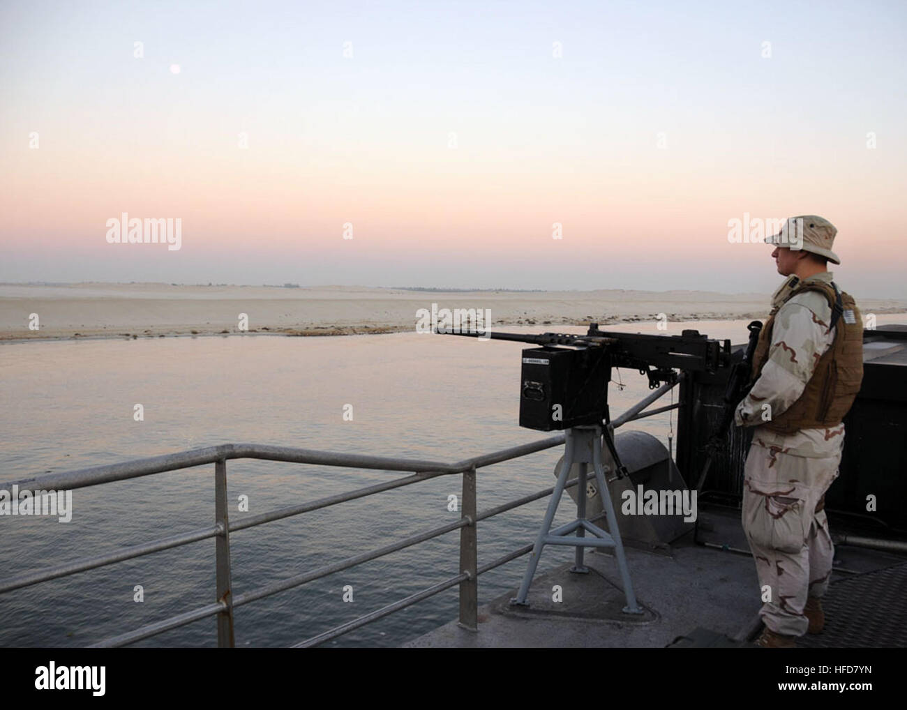 Seaman Michael Holubik, a master at arms, stands lookout watch aboard ...
