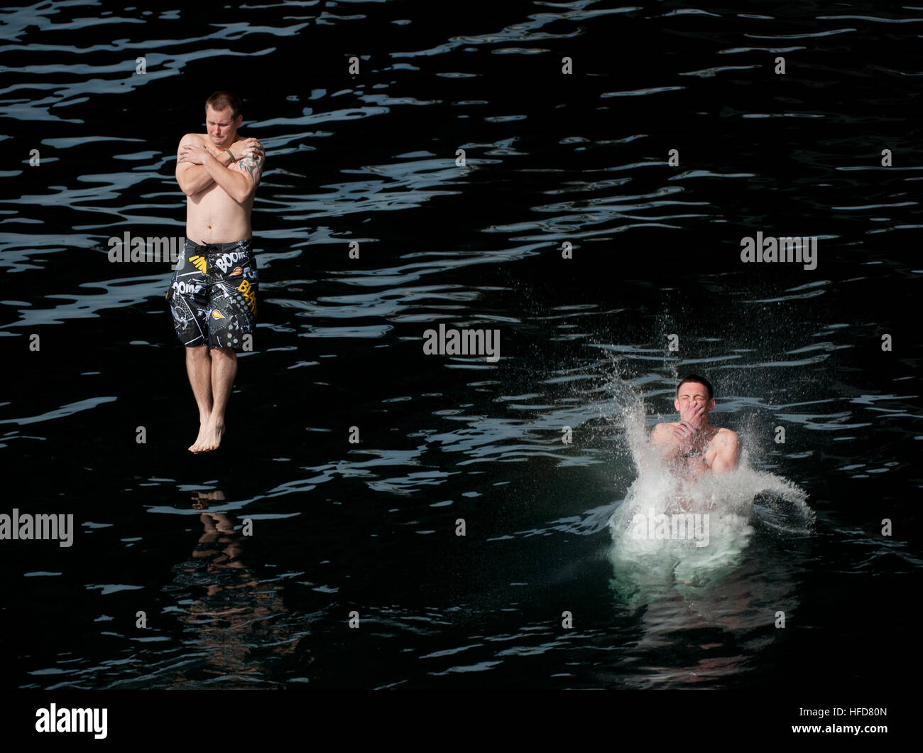 Sailors jump off aircraft elevator hi-res stock photography and images ...