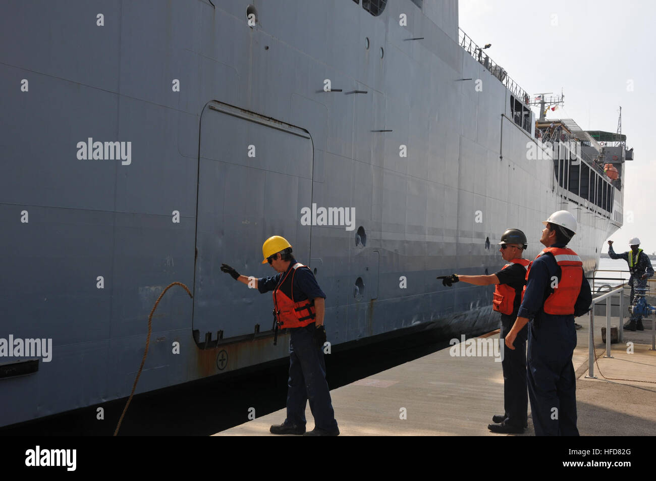 Line handlers with the port operations department at Naval Station Rota ...