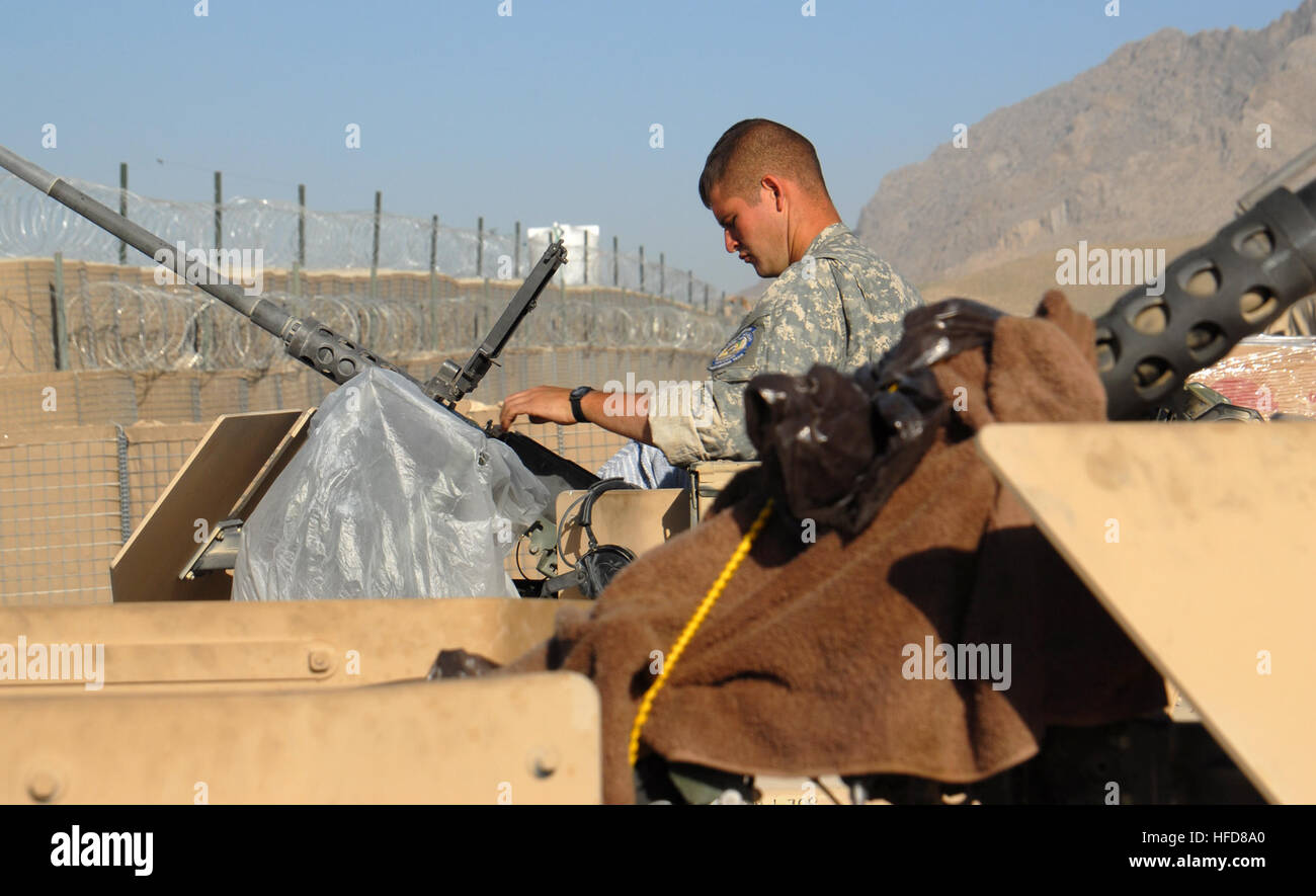 Spc. Charles Stackhouse checks his M2 .50-caliber machine gun prior to ...