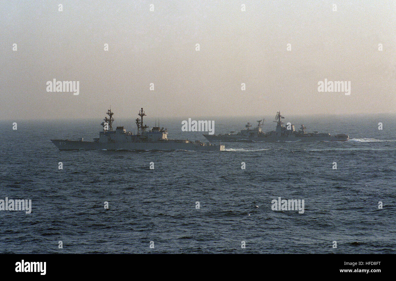 The destroyer USS JOHN YOUNG (DD 973), foreground, screens a Soviet ...