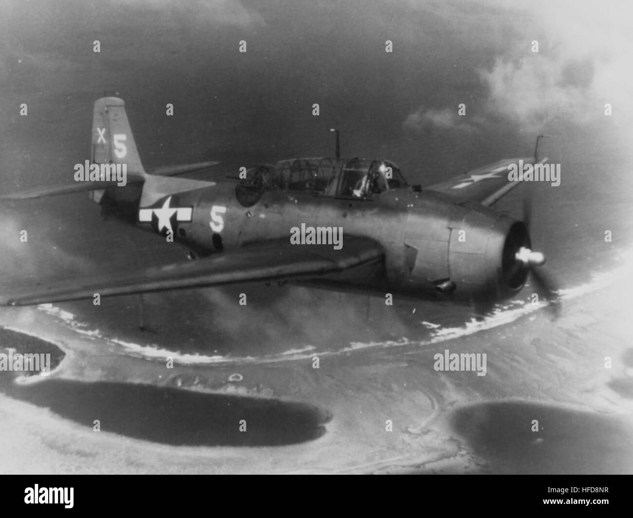 TBM-1C "Avenger" torpedo bomber, of VT-51 flying over Majuro Atoll, Marshall Islands, on 30 May ...