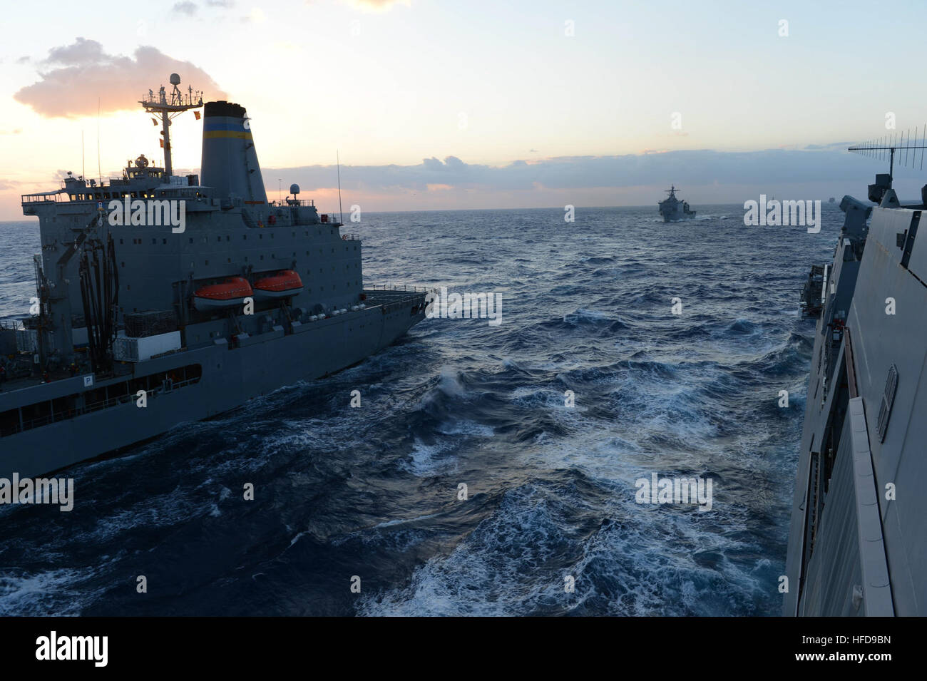 The amphibious transport dock ship USS Mesa Verde (LPD 19), right ...