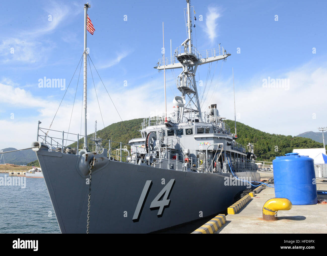 The mine countermeasures ship USS Chief (MCM 14) is moored to a pier at ...